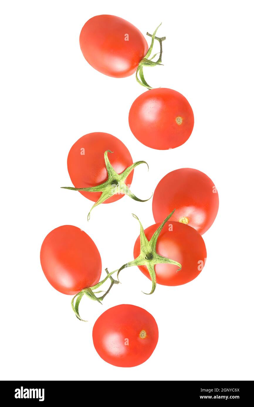 Isolated vegetables. Seven whole tomatoes in the air on white with ...