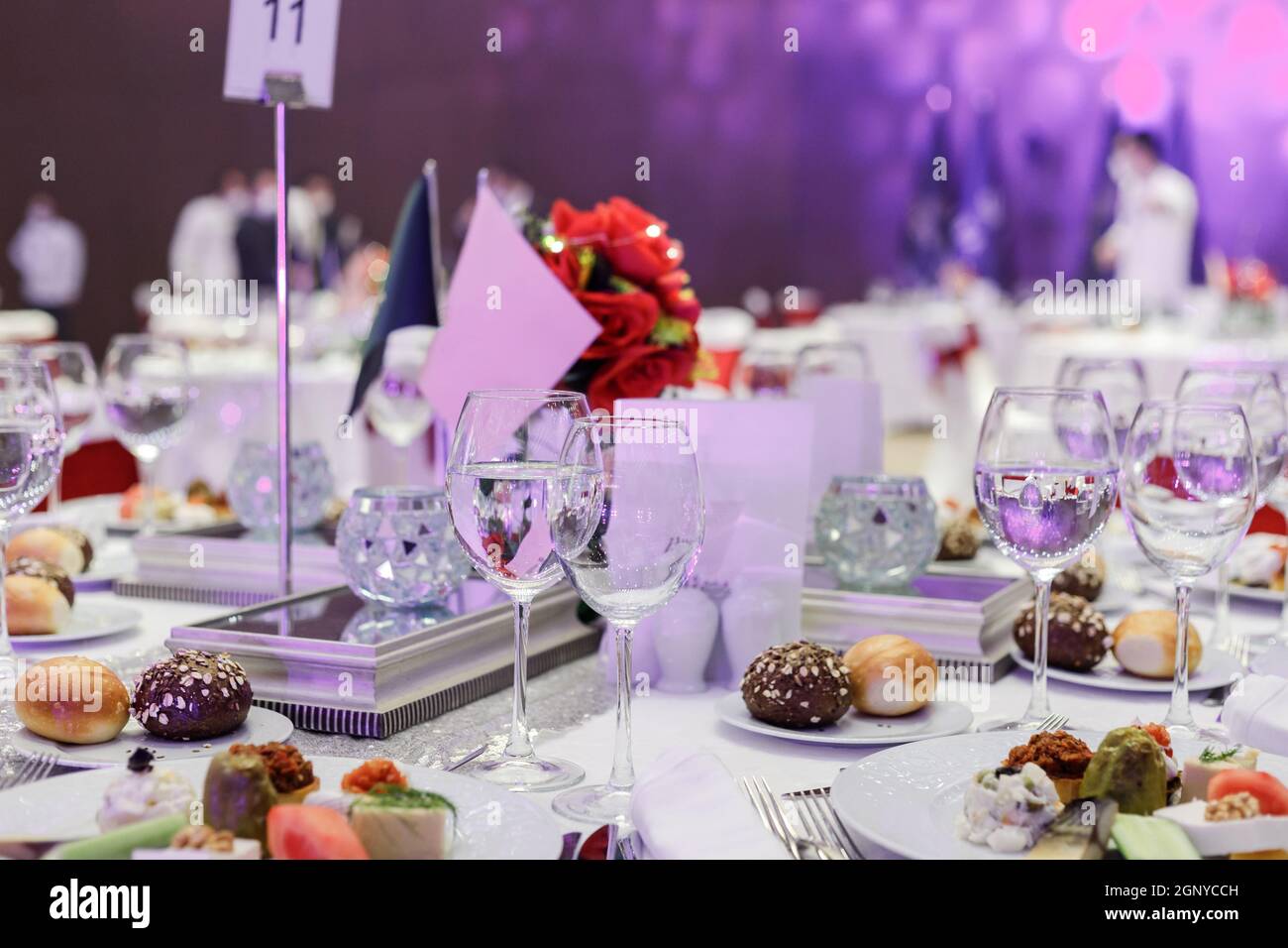 Festive round table setting in a prestigious restaurant for dinner ...