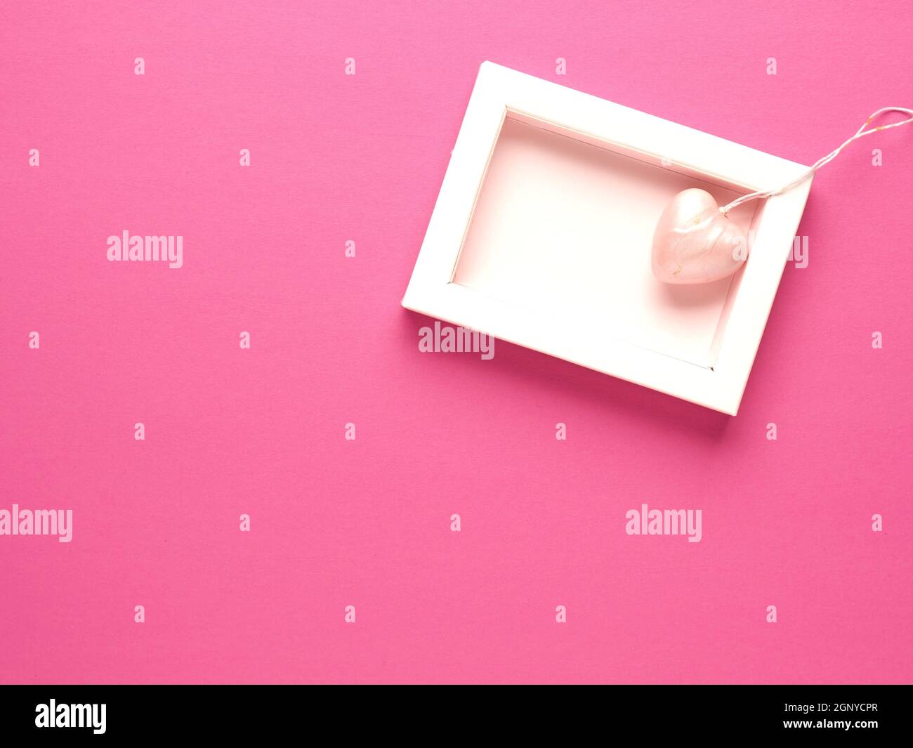 Heart shape in a box on a pink background with space for text Stock ...
