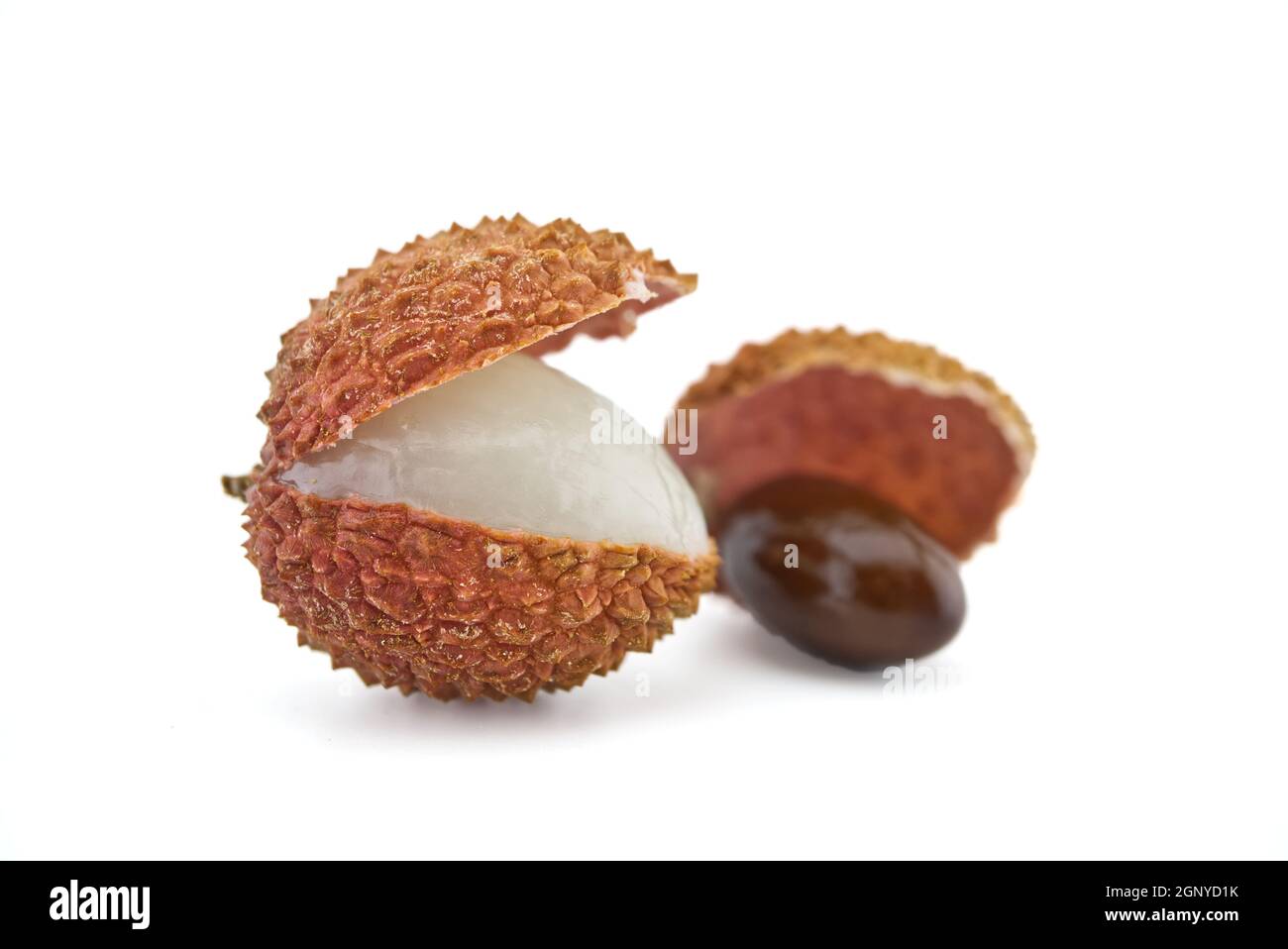 Lychee fruit opened and showing seed isolated on white background Stock ...
