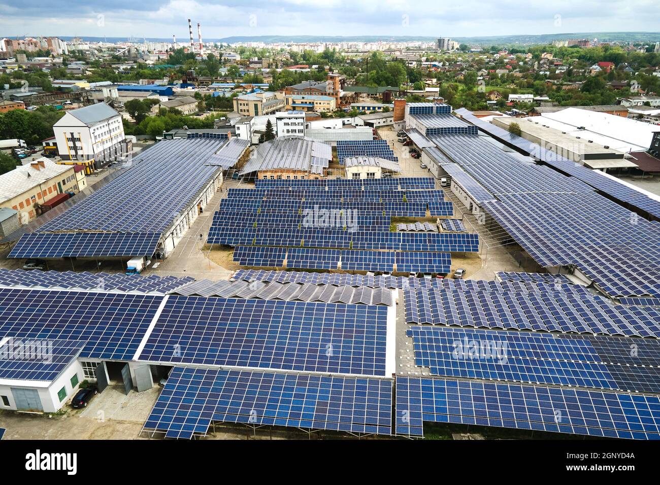 Aerial view of solar power plant with blue photovoltaic panels mounted ...