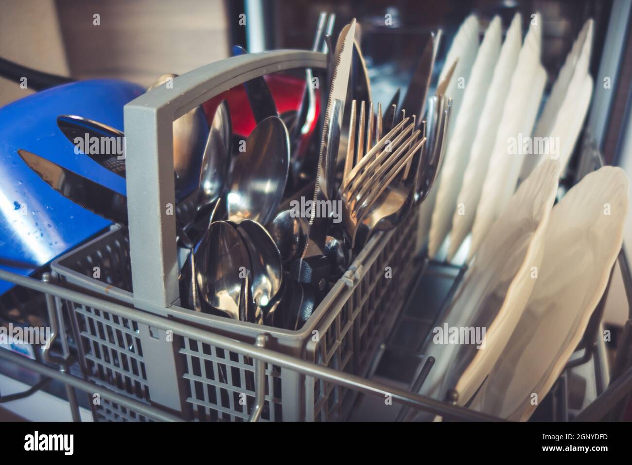 Open dishwasher in a kitchen. Closeup view Stock Photo - Alamy