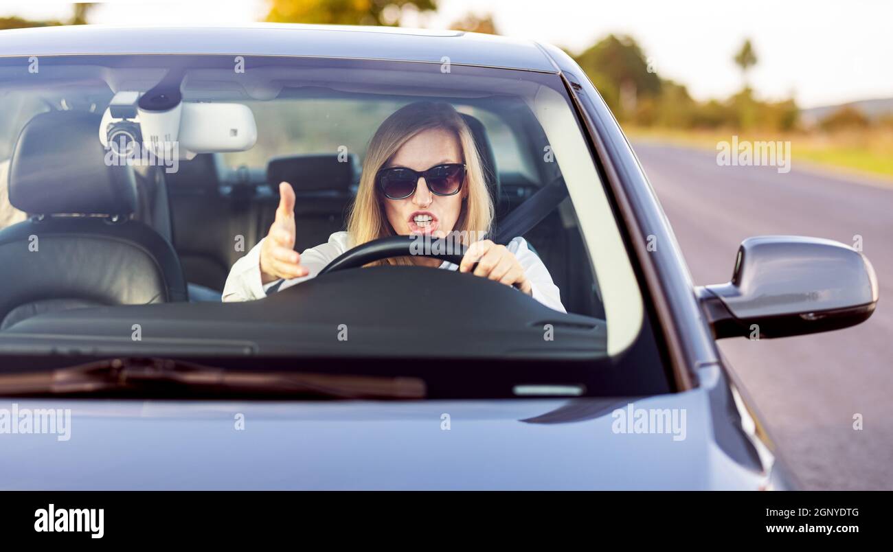 Angry female driver in auto Stock Photo - Alamy