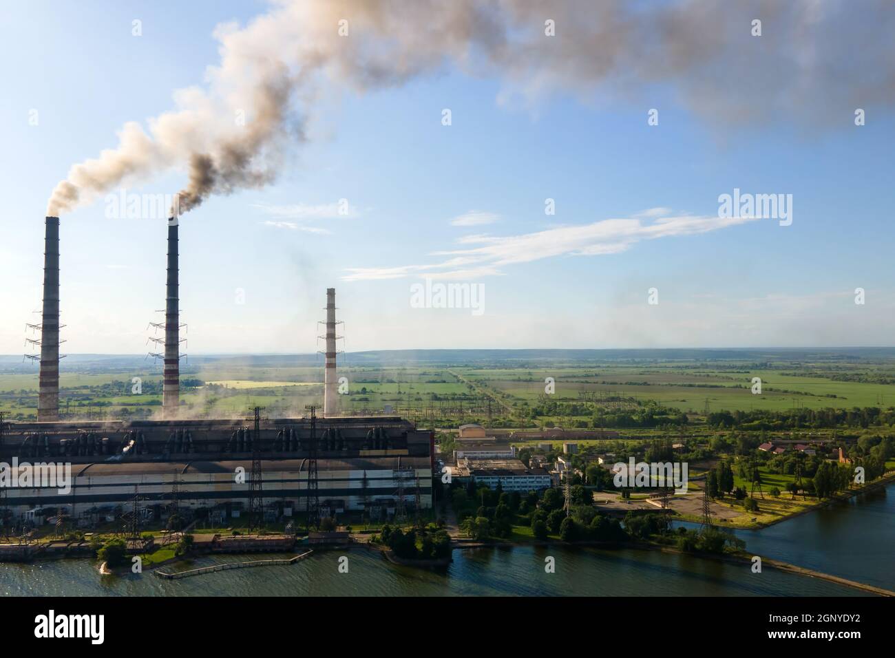 Aerial view of coal power plant high pipes with black smokestack ...