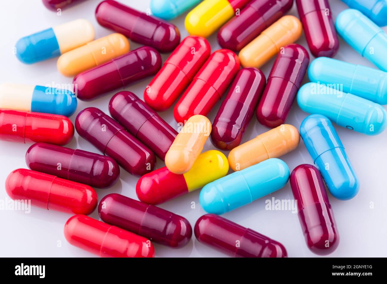 Tablets pills capsule heap mix therapy drugs, over a white background ...