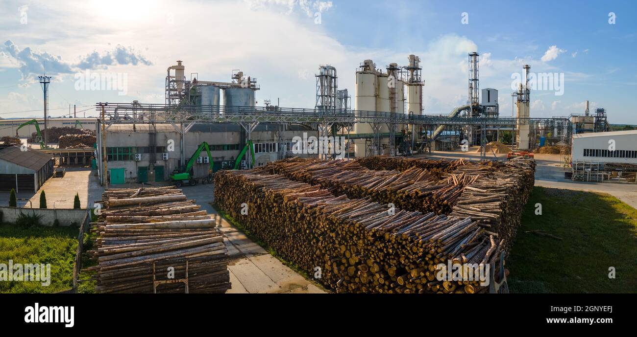 Aerial view of wood processing factory with stacks of lumber at plant ...