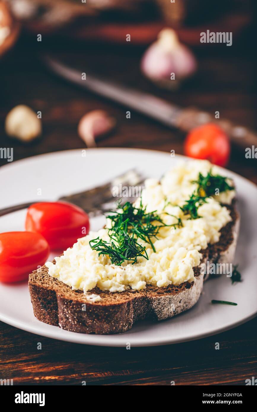 Rye bread toast with processed cheese, garlic and dill Stock Photo - Alamy