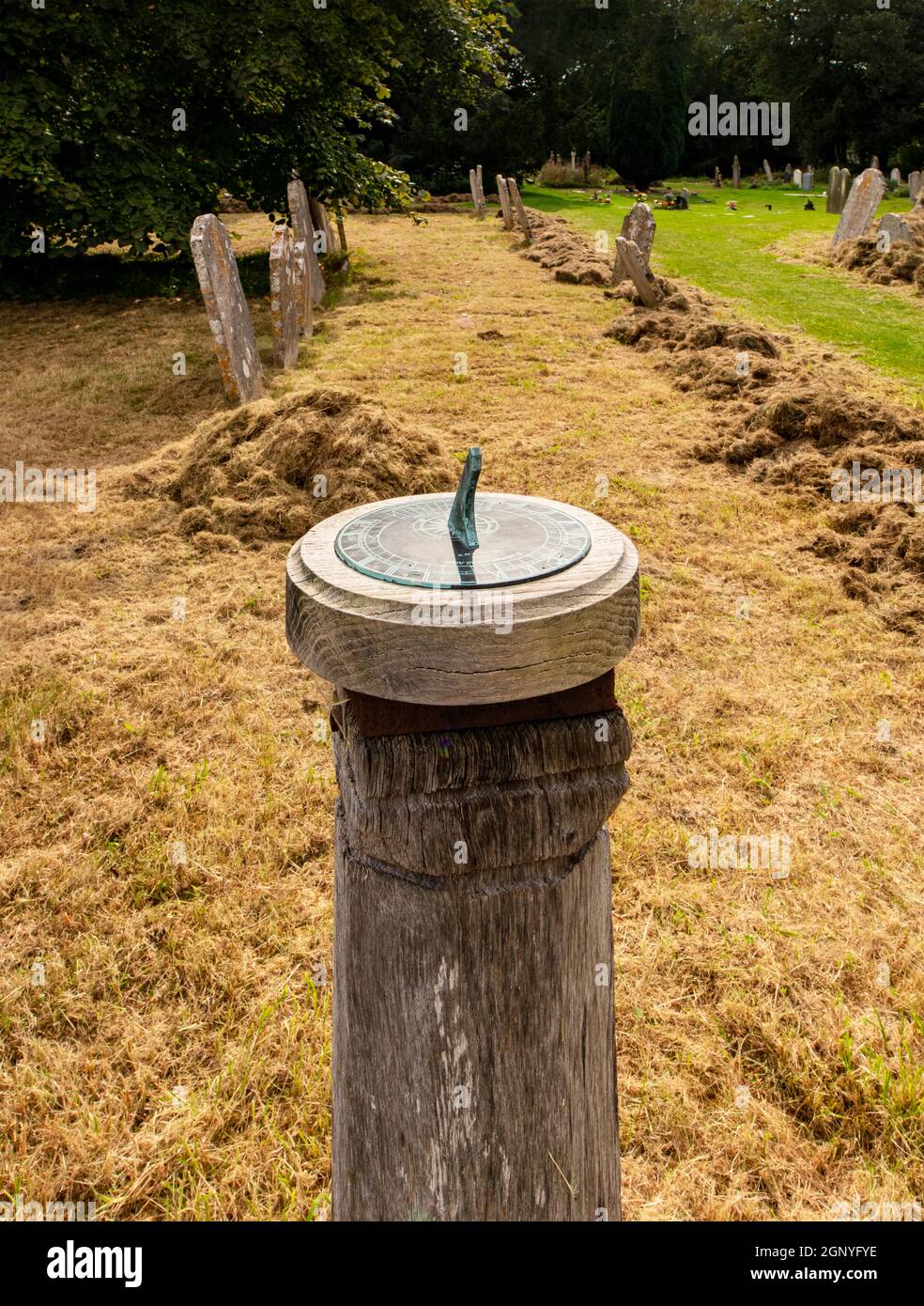 Modern sundial in the churchyard of St Michael's Church, Amberley, West ...