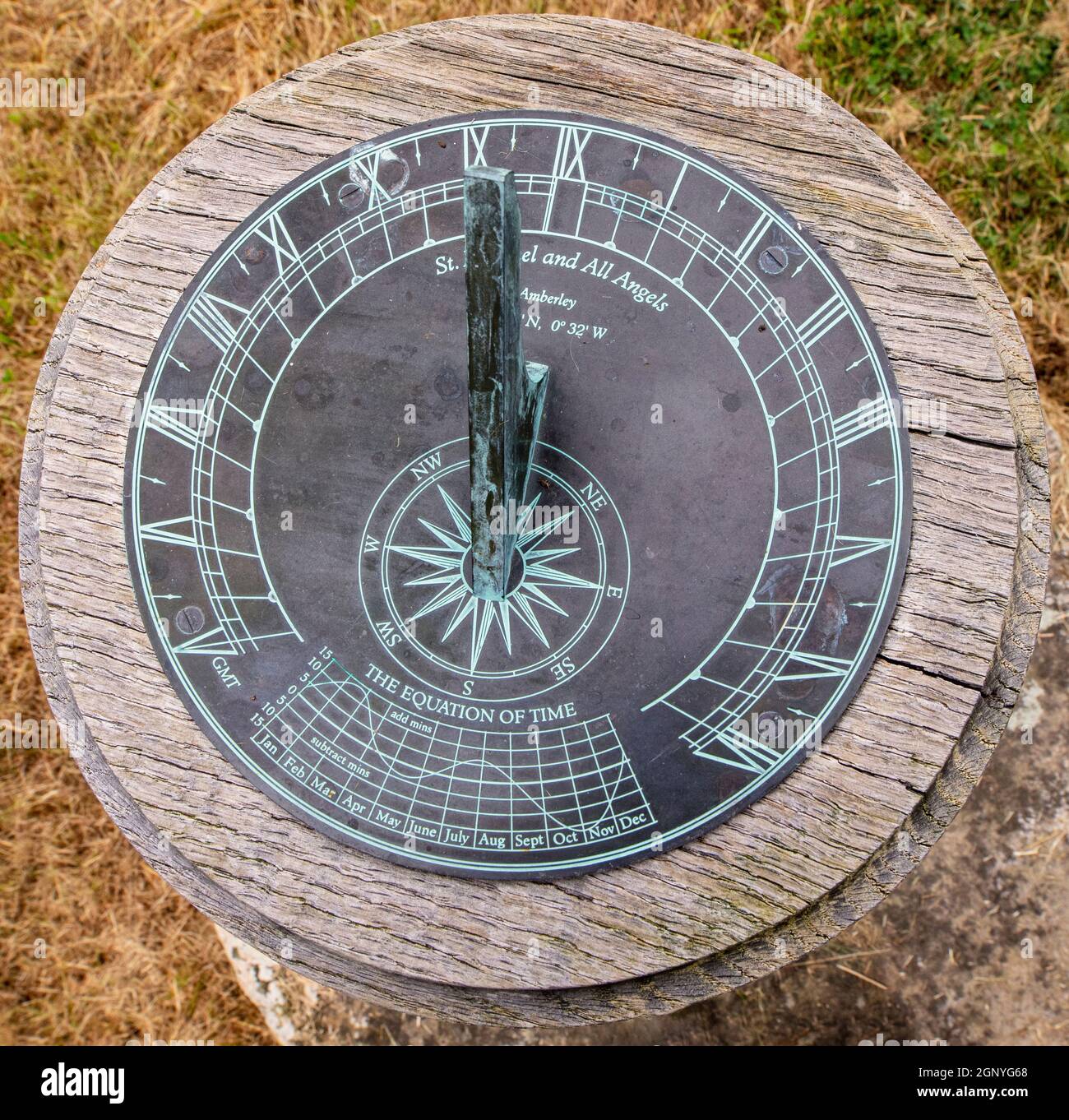 Modern sundial in the churchyard of St Michael's Church, Amberley, West ...