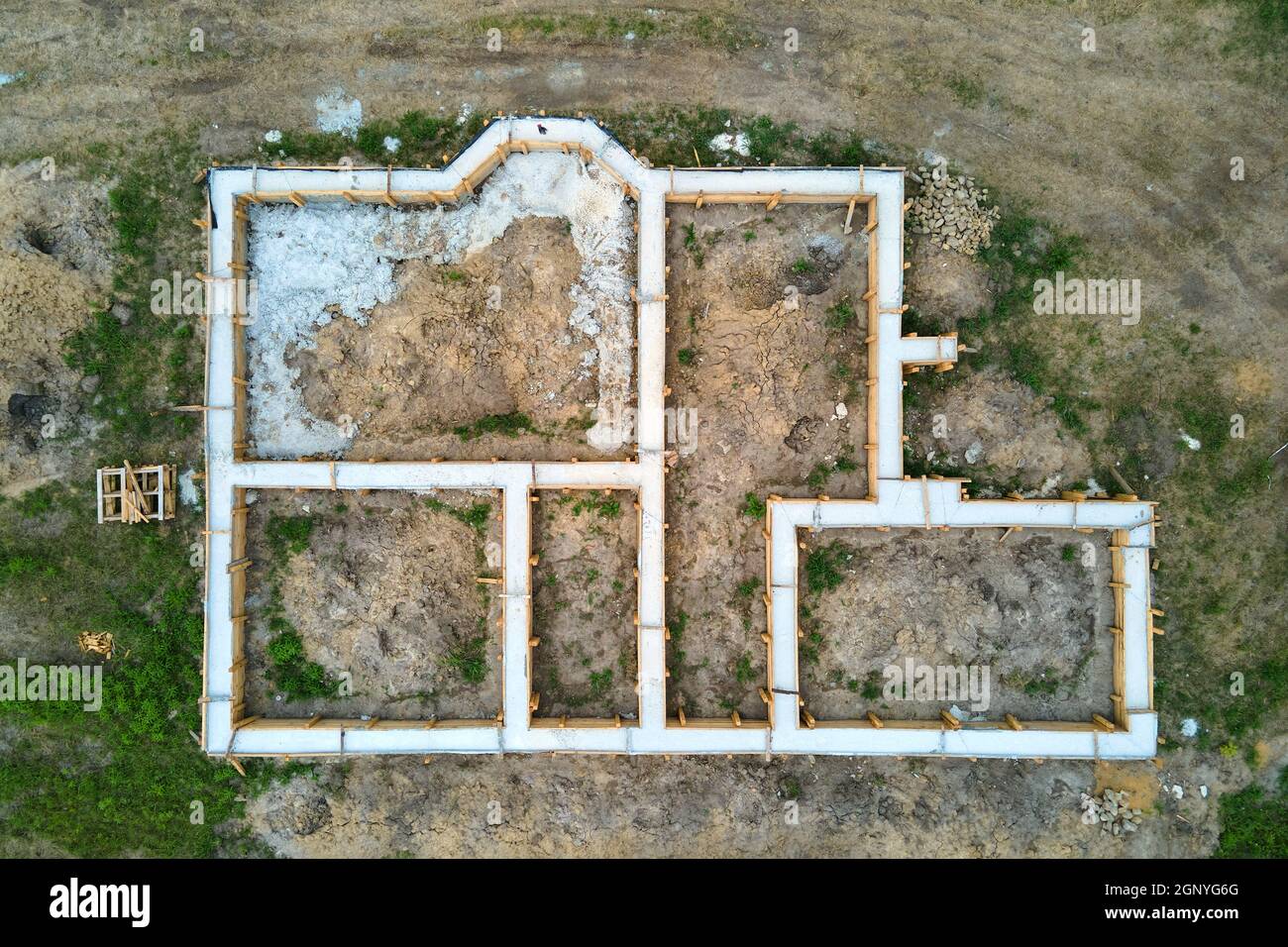Top down aerial view of building works of new house concrete foundation ...