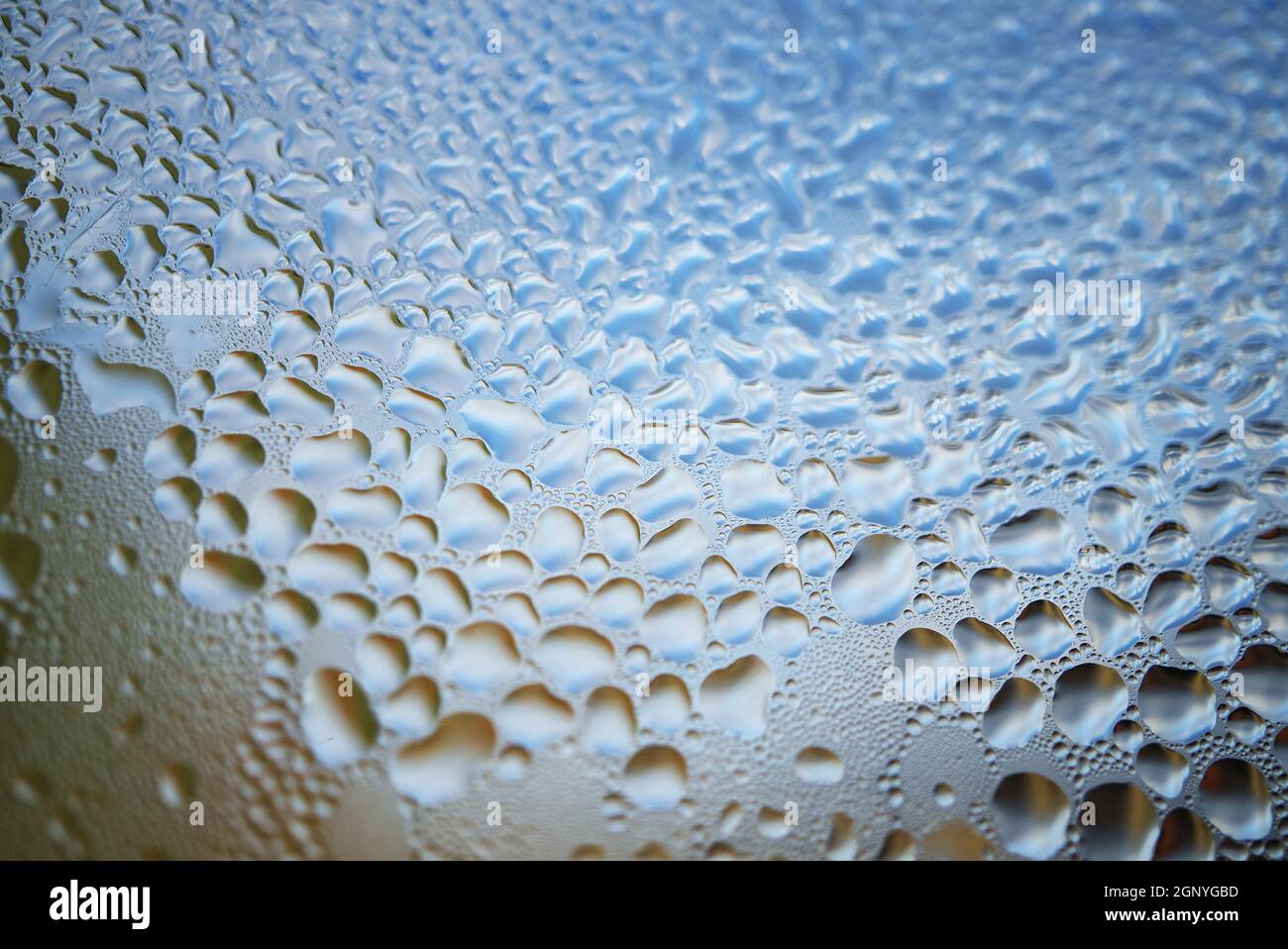 Condensation with beaded moisture droplets on the outside of a cold ...