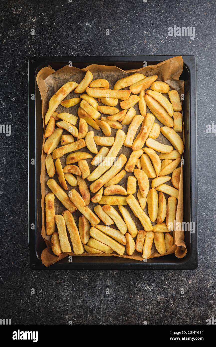Big french fries. Fried potato chips. Top view Stock Photo - Alamy