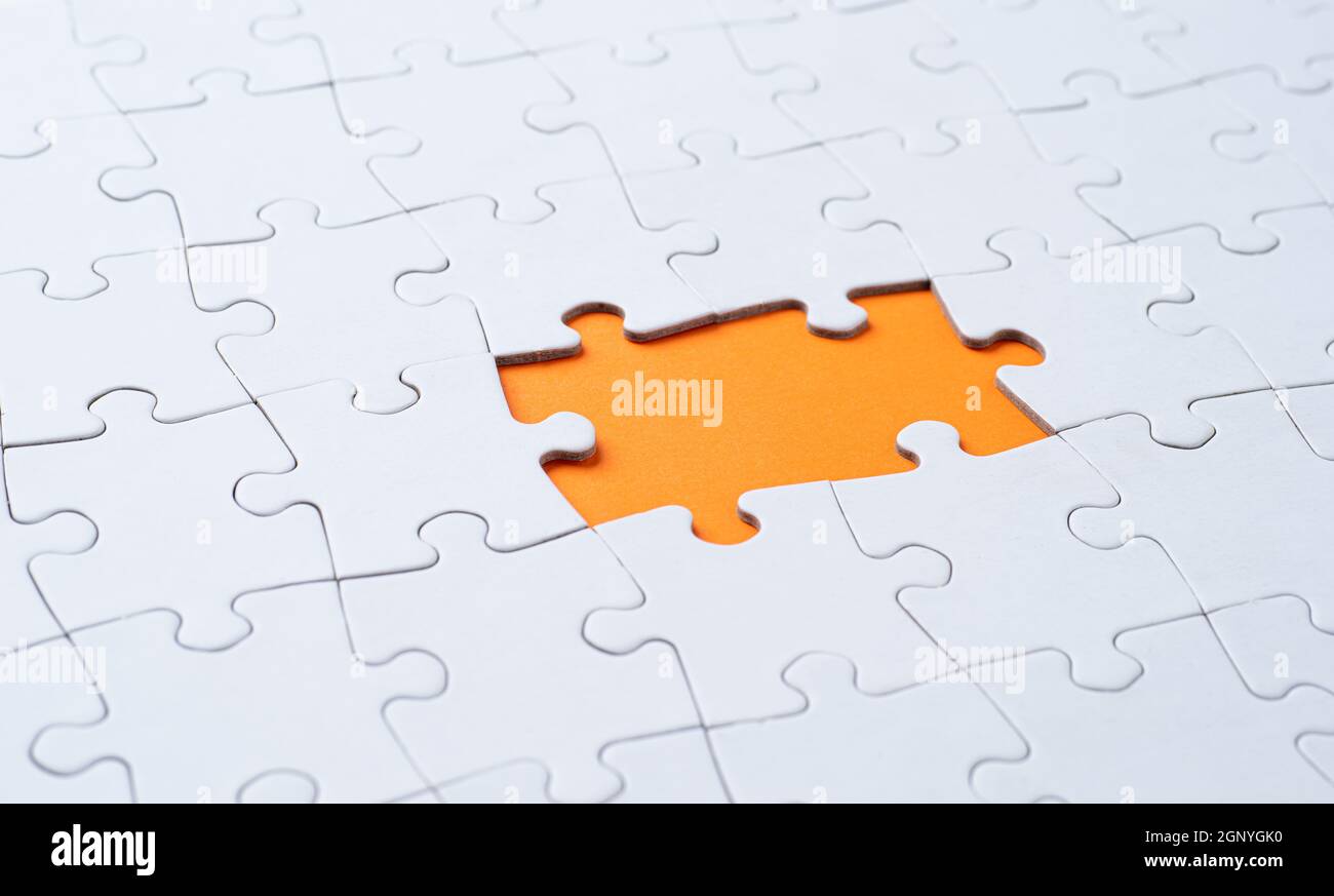 Empty white jigsaw puzzle with missing pieces Stock Photo - Alamy