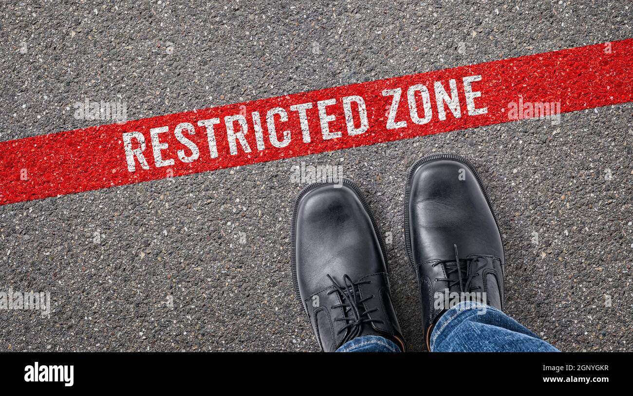 Red line on asphalt - Restricted zone Stock Photo - Alamy