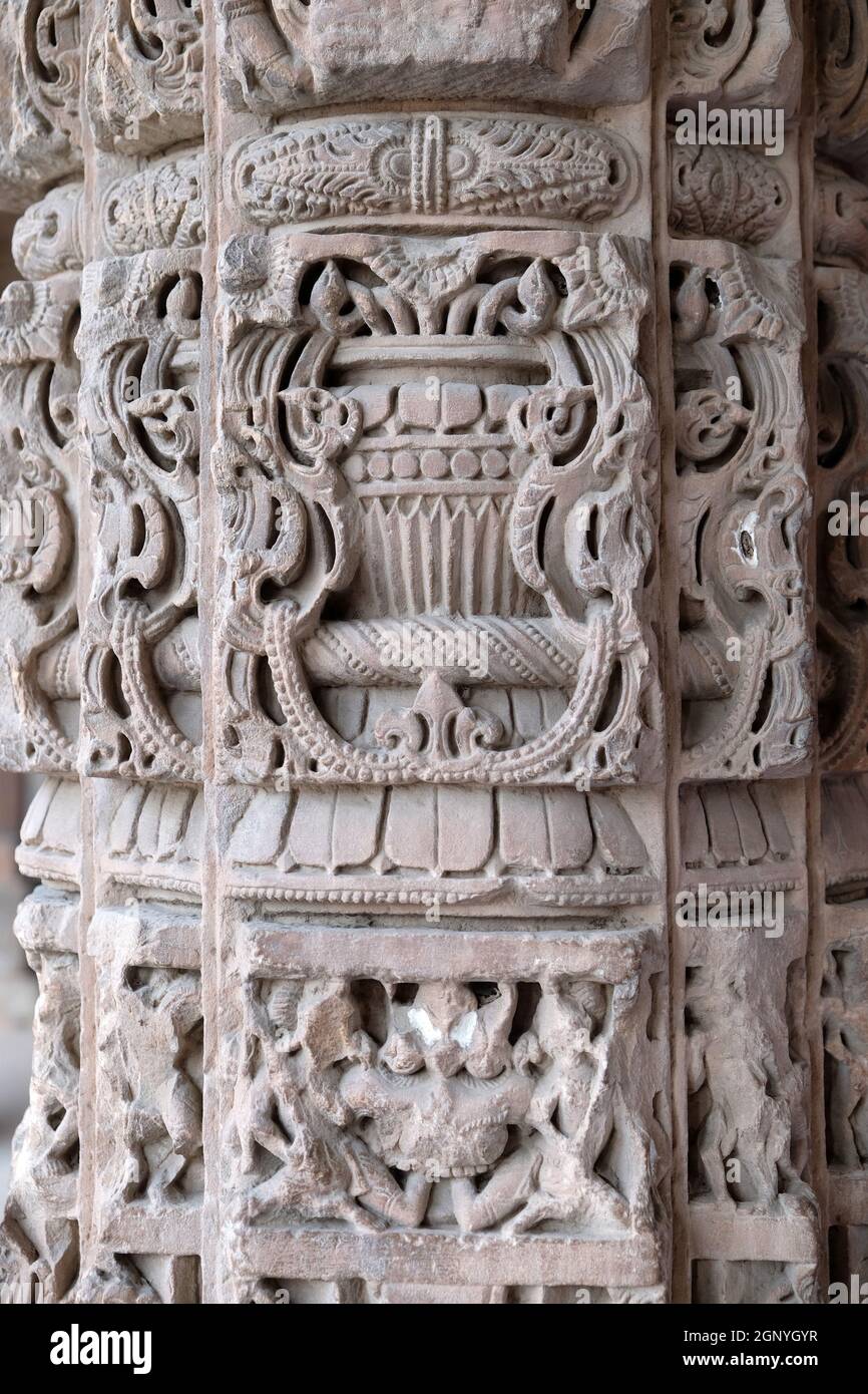 Columns with stone carving in courtyard of Quwwat-Ul-Islam mosque ...
