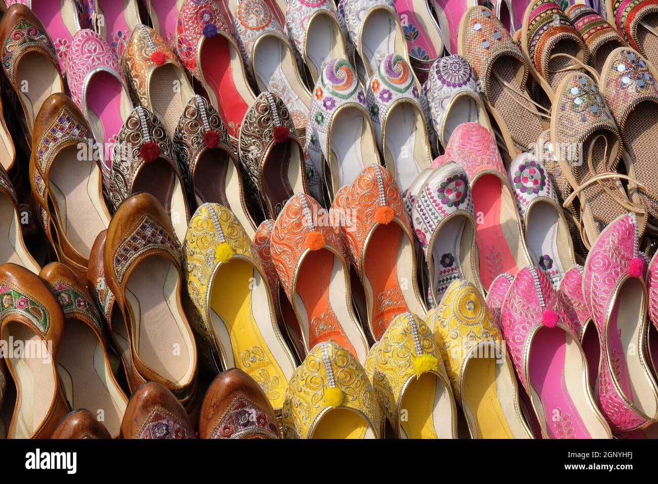 Display of traditional shoes at the street market in Jaipur Stock Photo ...