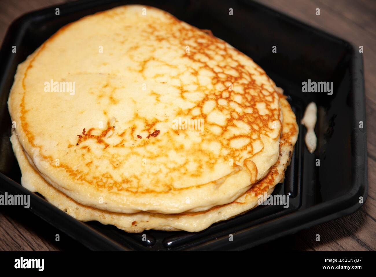Two plain pancakes prepared without syrup and butter Stock Photo - Alamy