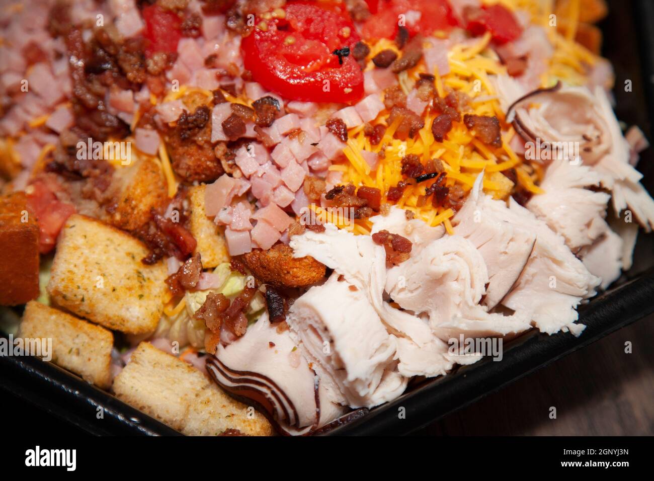 Chef salad with croutons, bacon, turkey, ham, and tomato Stock Photo ...