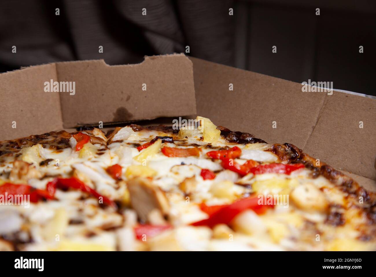 Barbeque chicken, red bell pepper, onion, pineapple pizza in its ...
