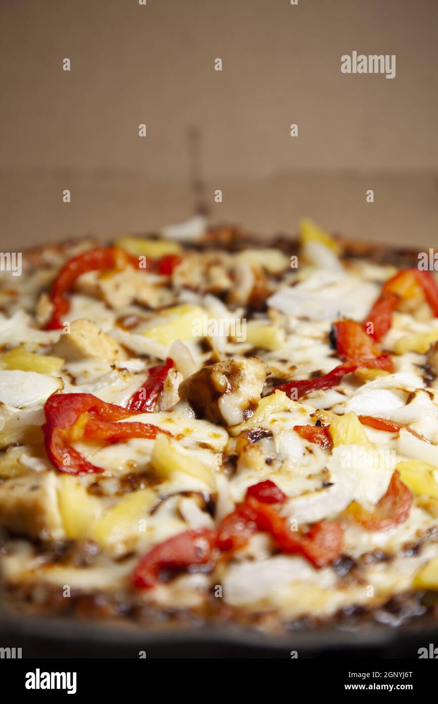 Barbeque chicken, red bell pepper, onion, pineapple pizza in its ...