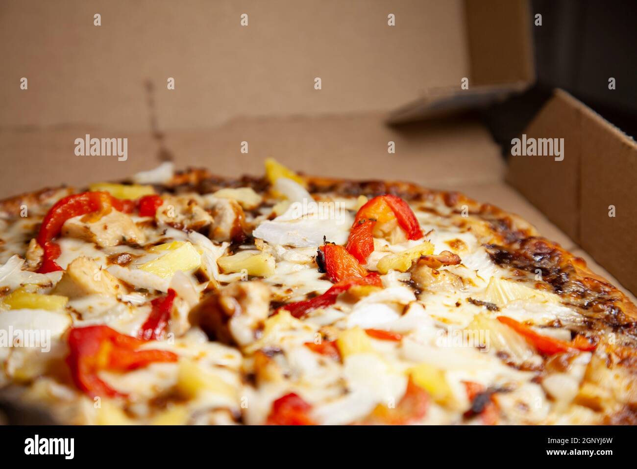 Barbeque chicken, red bell pepper, onion, pineapple pizza in its ...