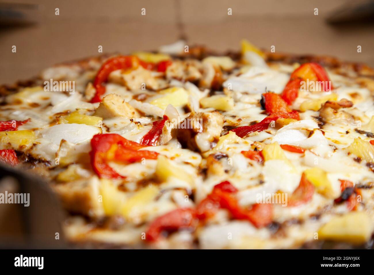 Barbeque chicken, red bell pepper, onion, pineapple pizza in its ...