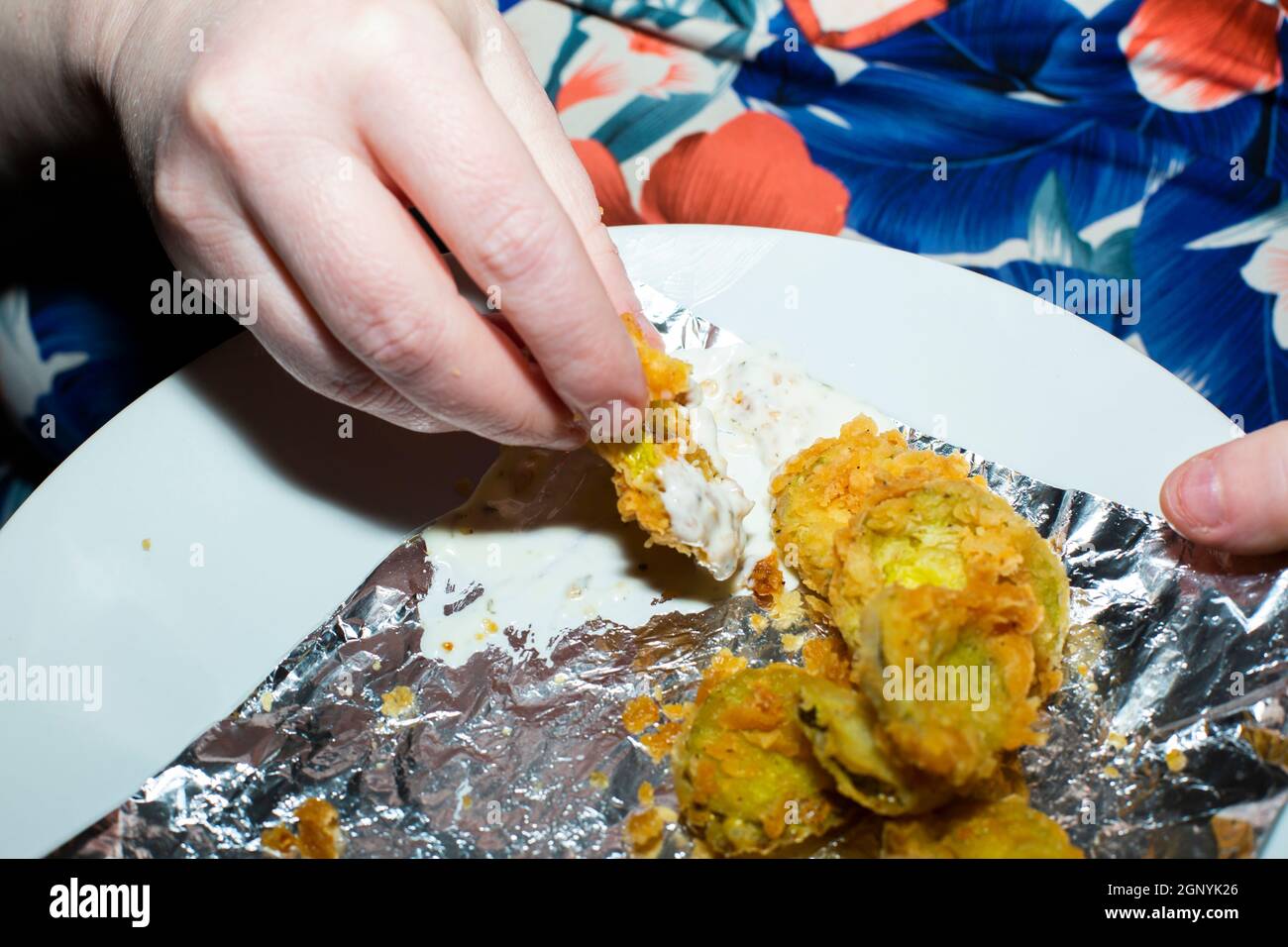 Woman eating pickle hi-res stock photography and images - Alamy
