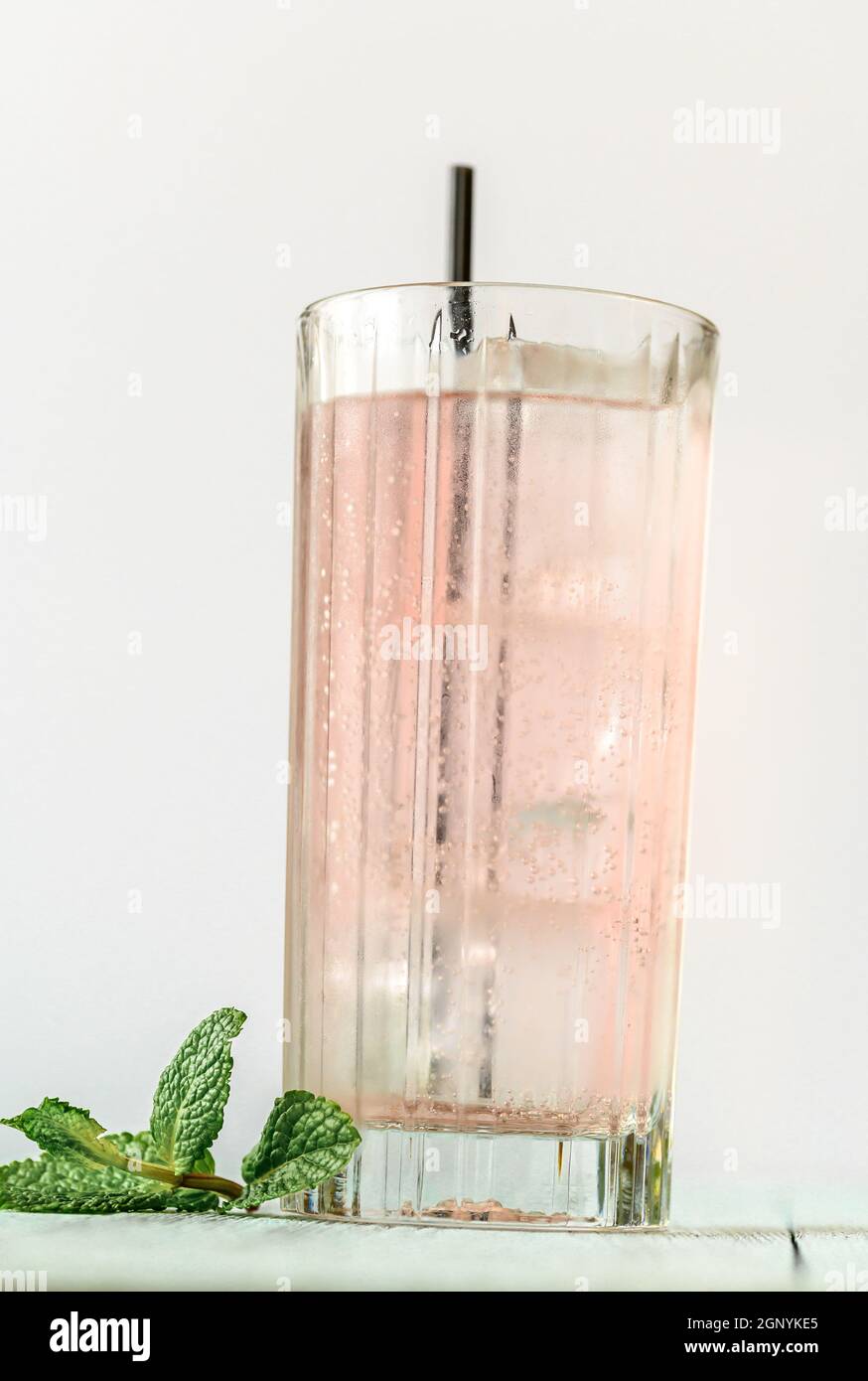 Glass of pink gin and tonic cocktail Stock Photo - Alamy