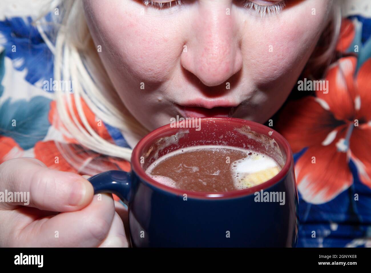 Woman drinking hot cocoa hi-res stock photography and images - Alamy