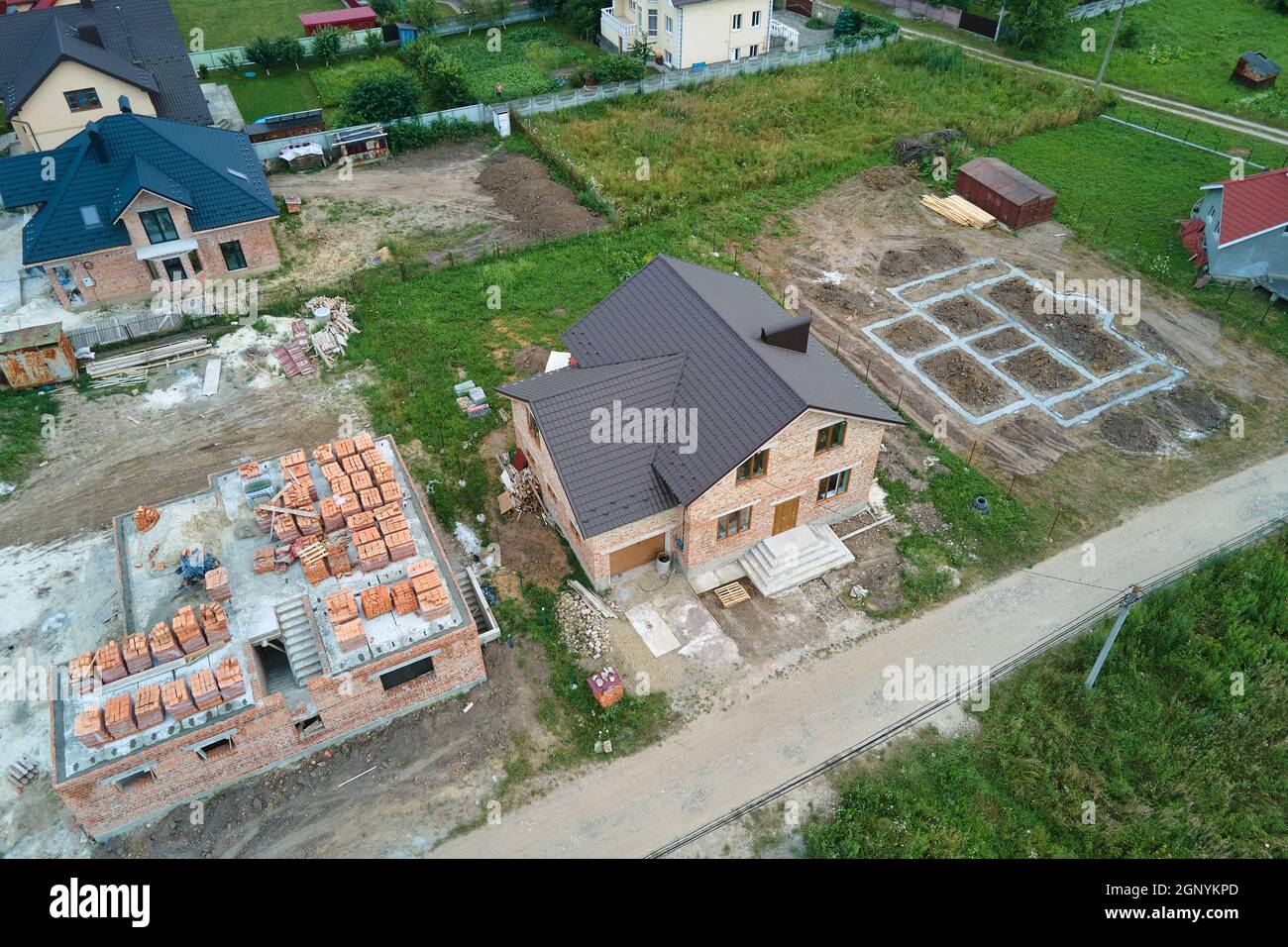 Top down aerial view of building works of new house concrete foundation ...
