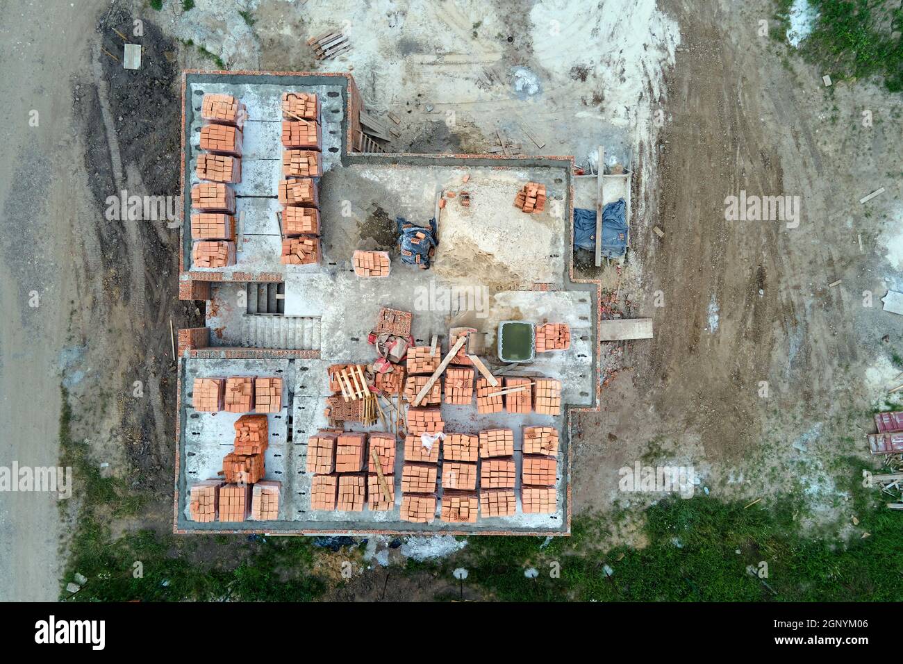 Top down aerial view of building works of new house concrete foundation ...