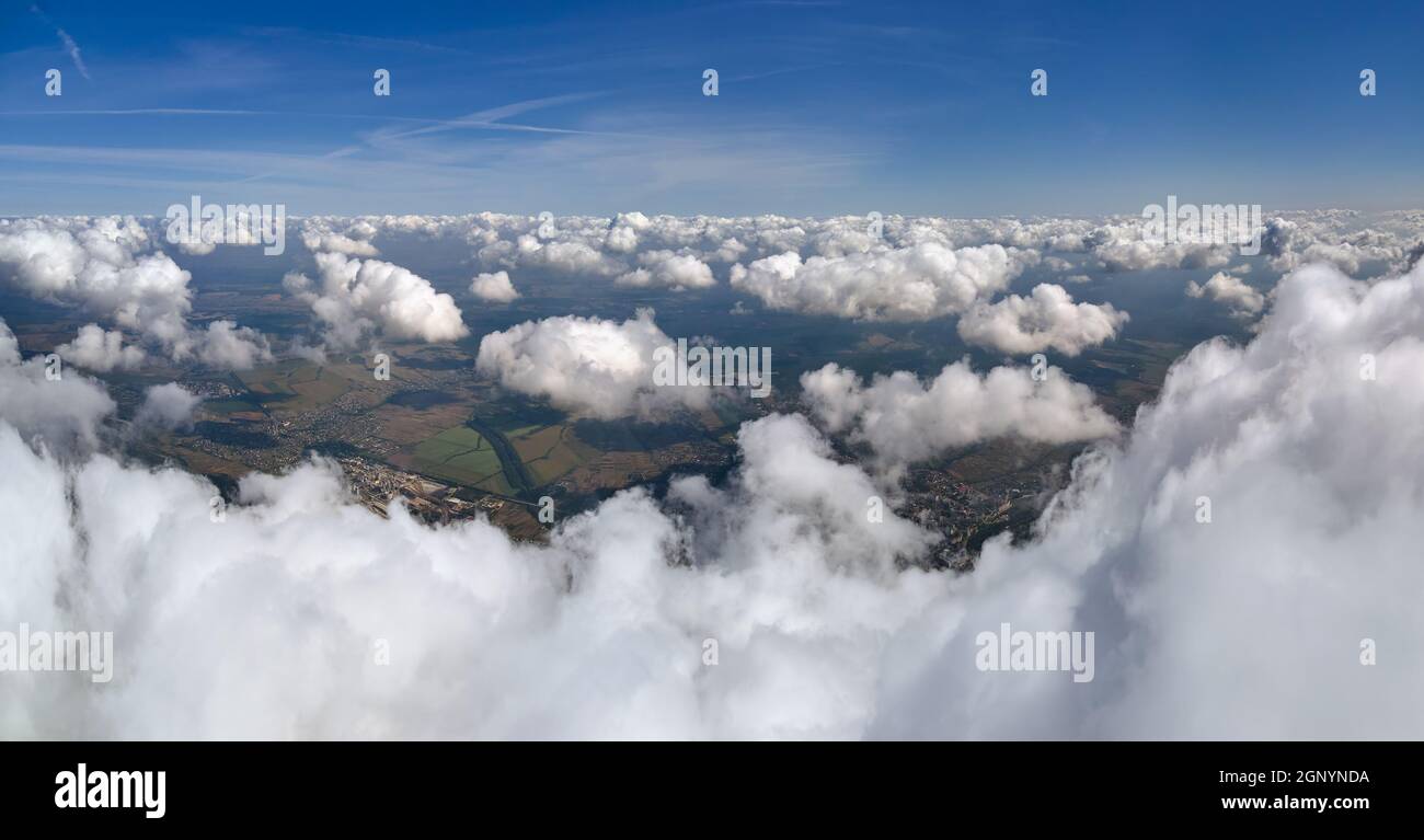 Aerial view from airplane window at high altitude of earth covered with ...