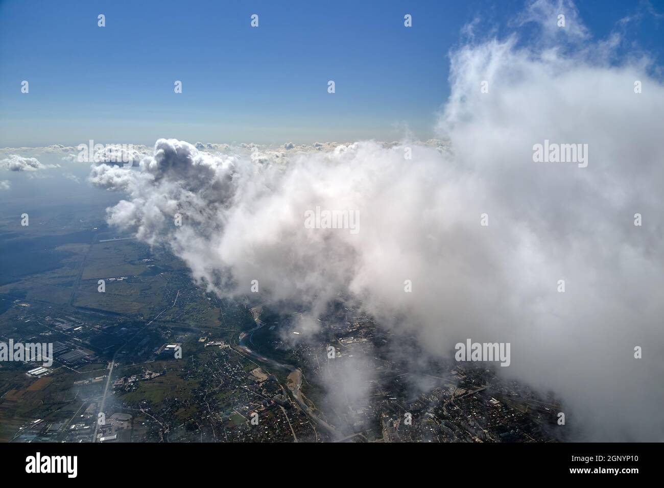 Aerial view from airplane window at high altitude of earth covered with ...