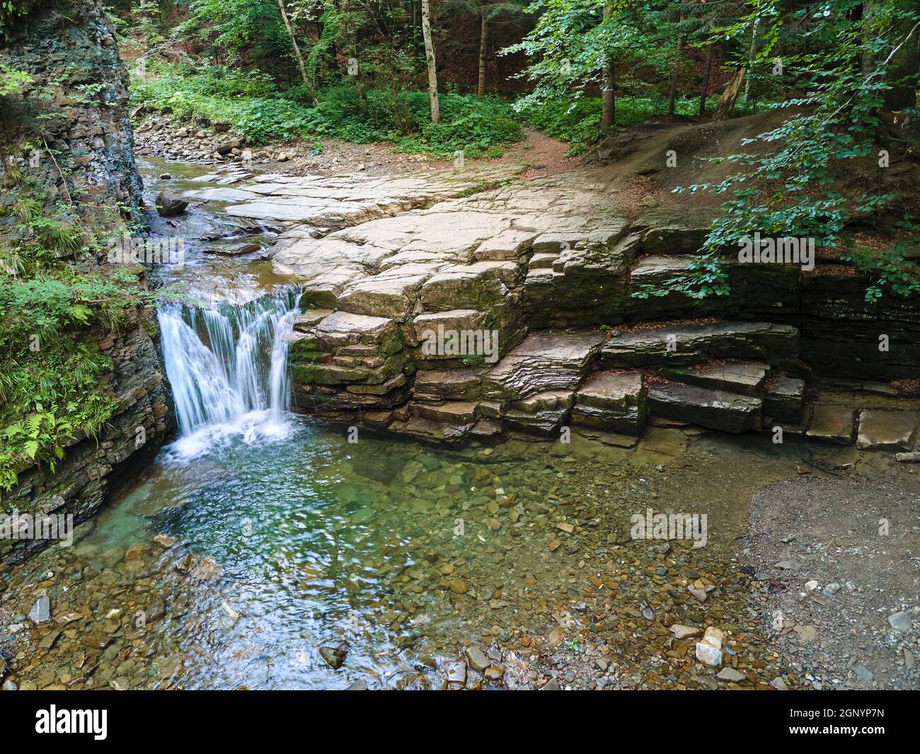 Amazing landscape of beautiful waterfall on mountain river with white ...