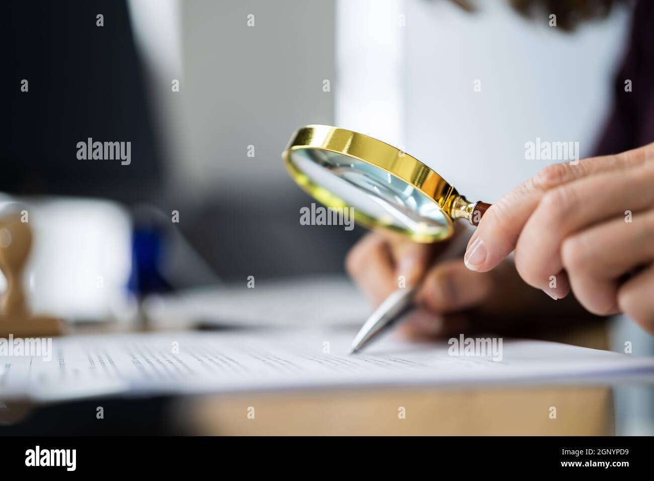 Auditor Doing Tax Fraud Investigation Using Magnifying Glass Stock ...