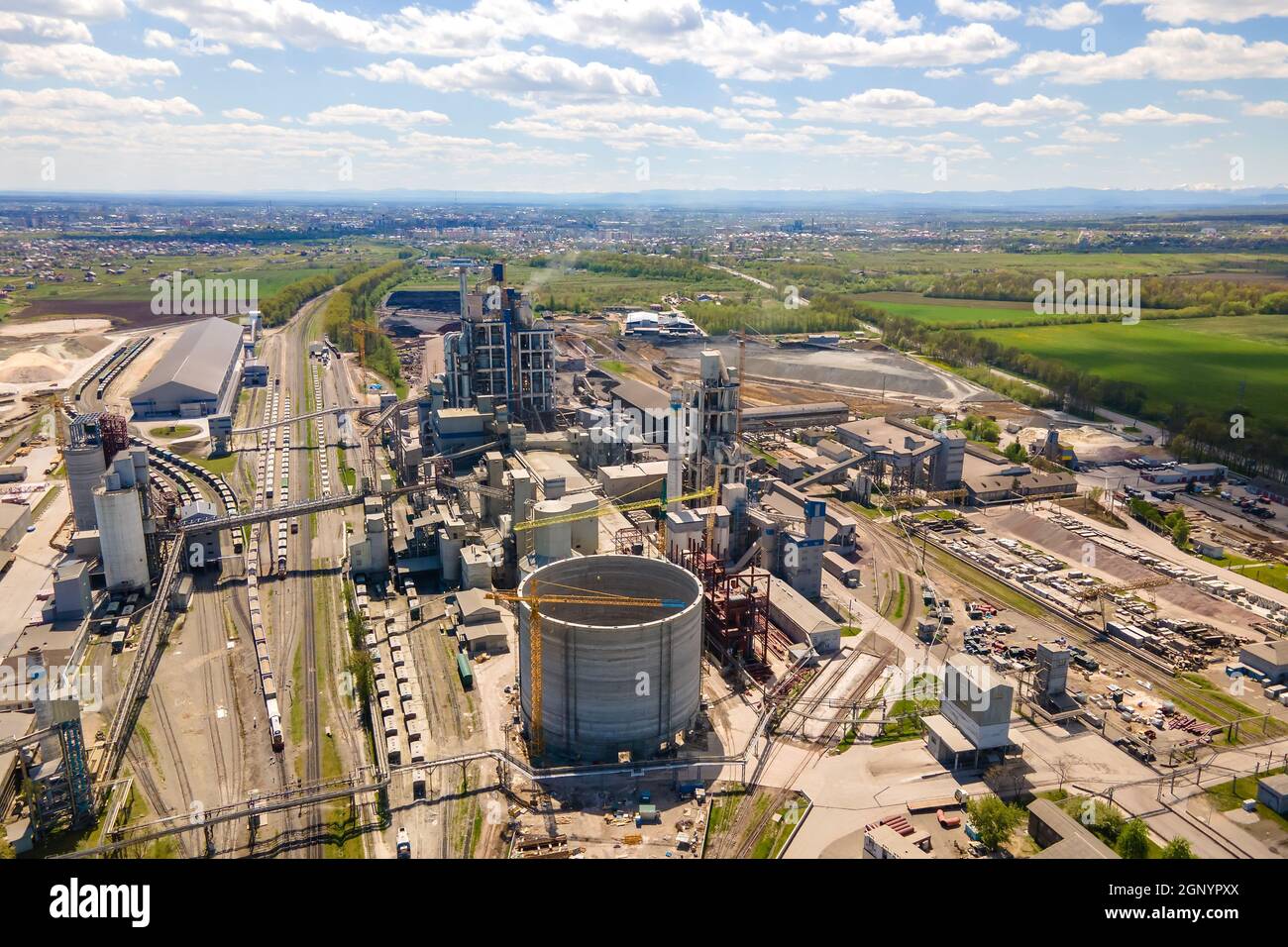 Aerial view of cement factory with high concrete structure and tower ...
