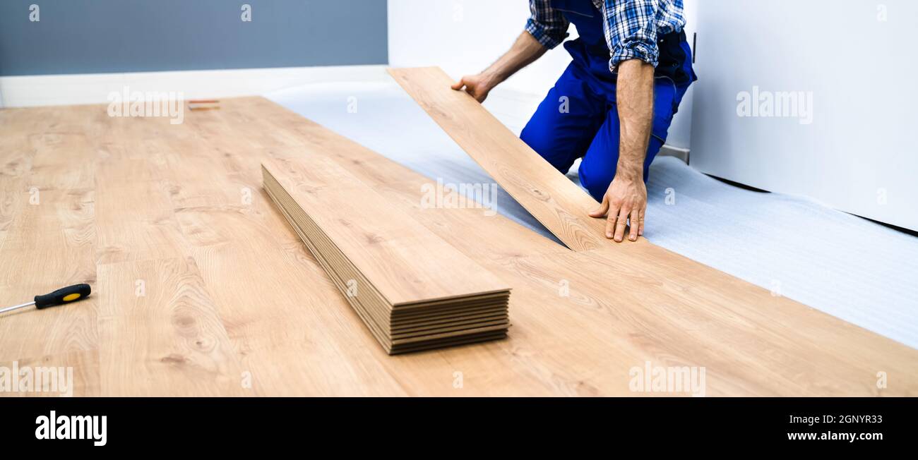 Worker Installing Home Floor. Carpenter Laying Laminate Flooring Stock ...