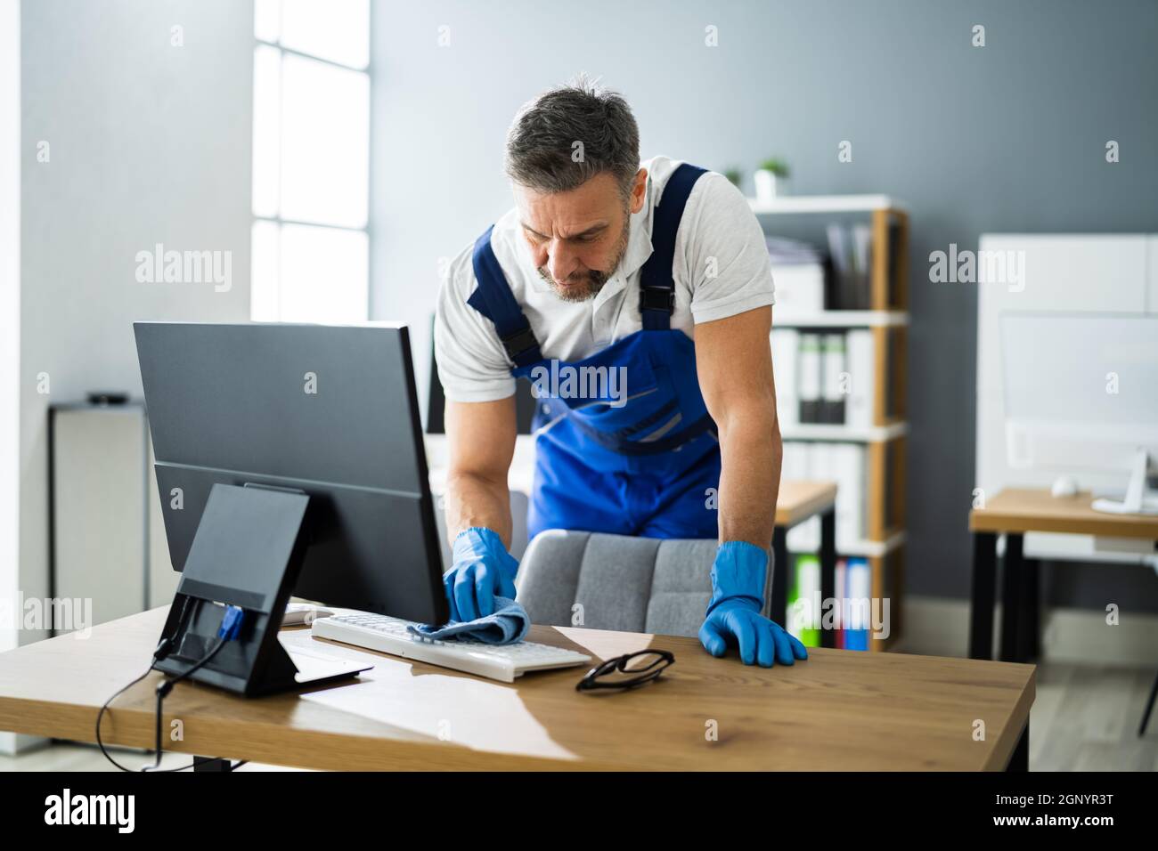 Professional Workplace Janitor Service. Office Desk Cleaning Stock ...