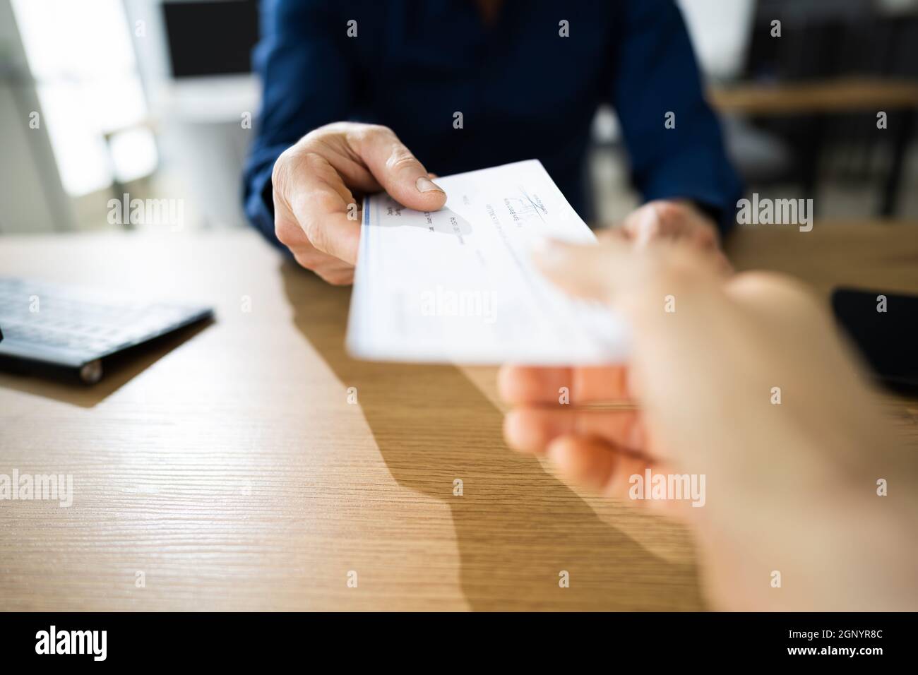 Executive Hand Giving Payment Check Or Compensation Cheque Stock Photo ...