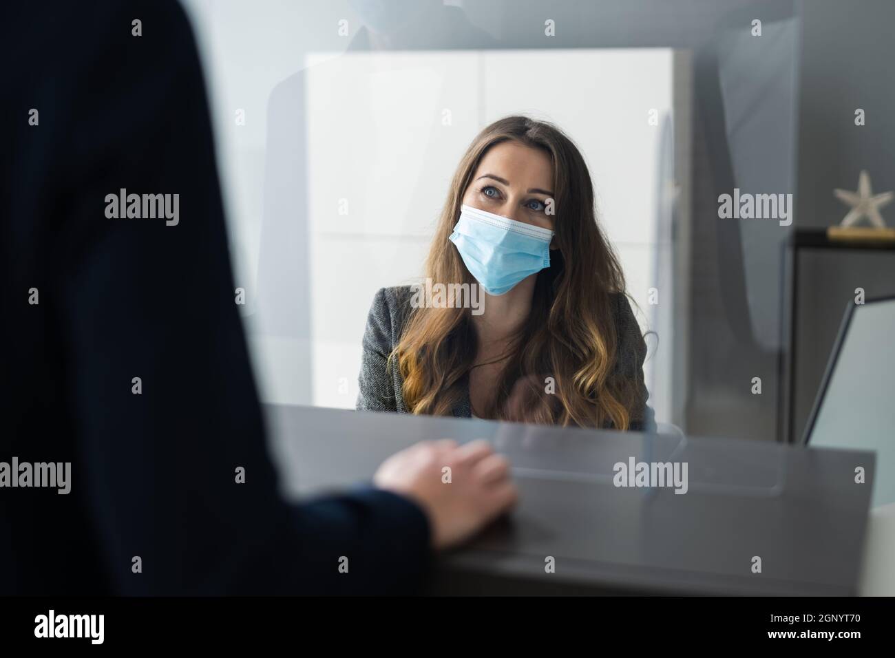 Client At Reception Desk Or Counter With Mask Stock Photo - Alamy