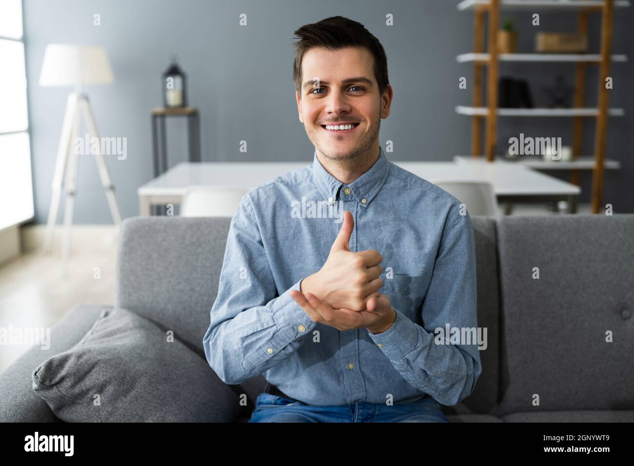Adult Learning Sign Language For Deaf Disabled Stock Photo - Alamy