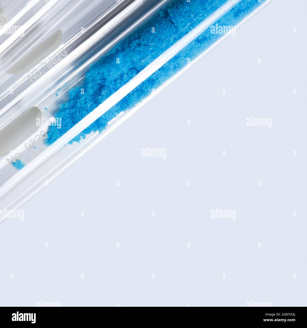 Blue flake chemicals in test tube, Copper(II) sulfate. Cosmetic ...