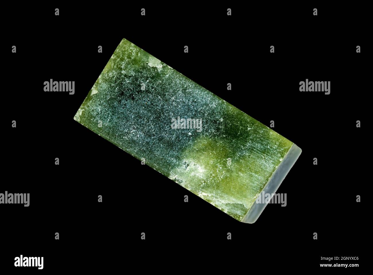 jadeite gemstone on a white background Stock Photo - Alamy