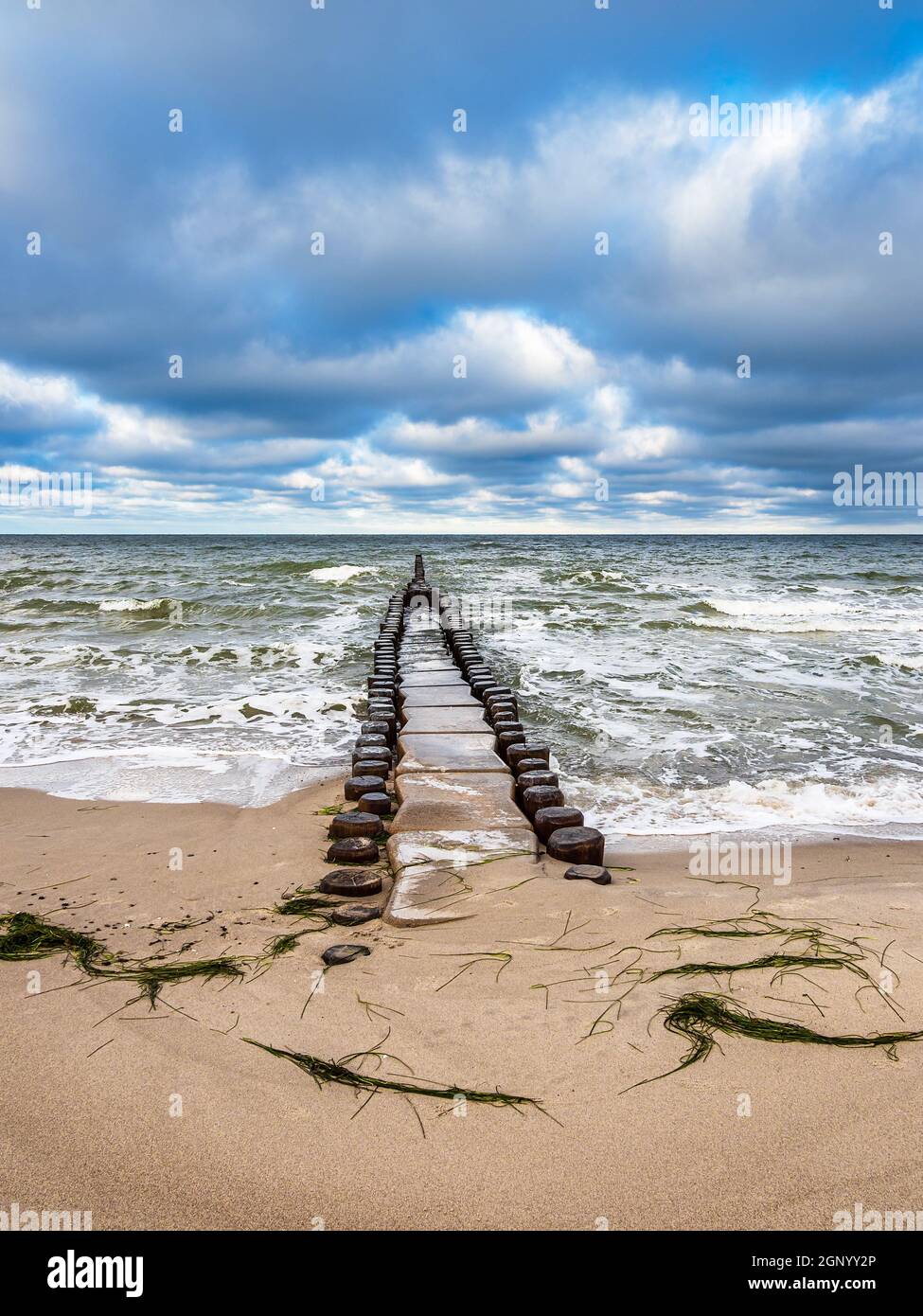 Groynes and waves on shore of the Baltic Sea Stock Photo - Alamy