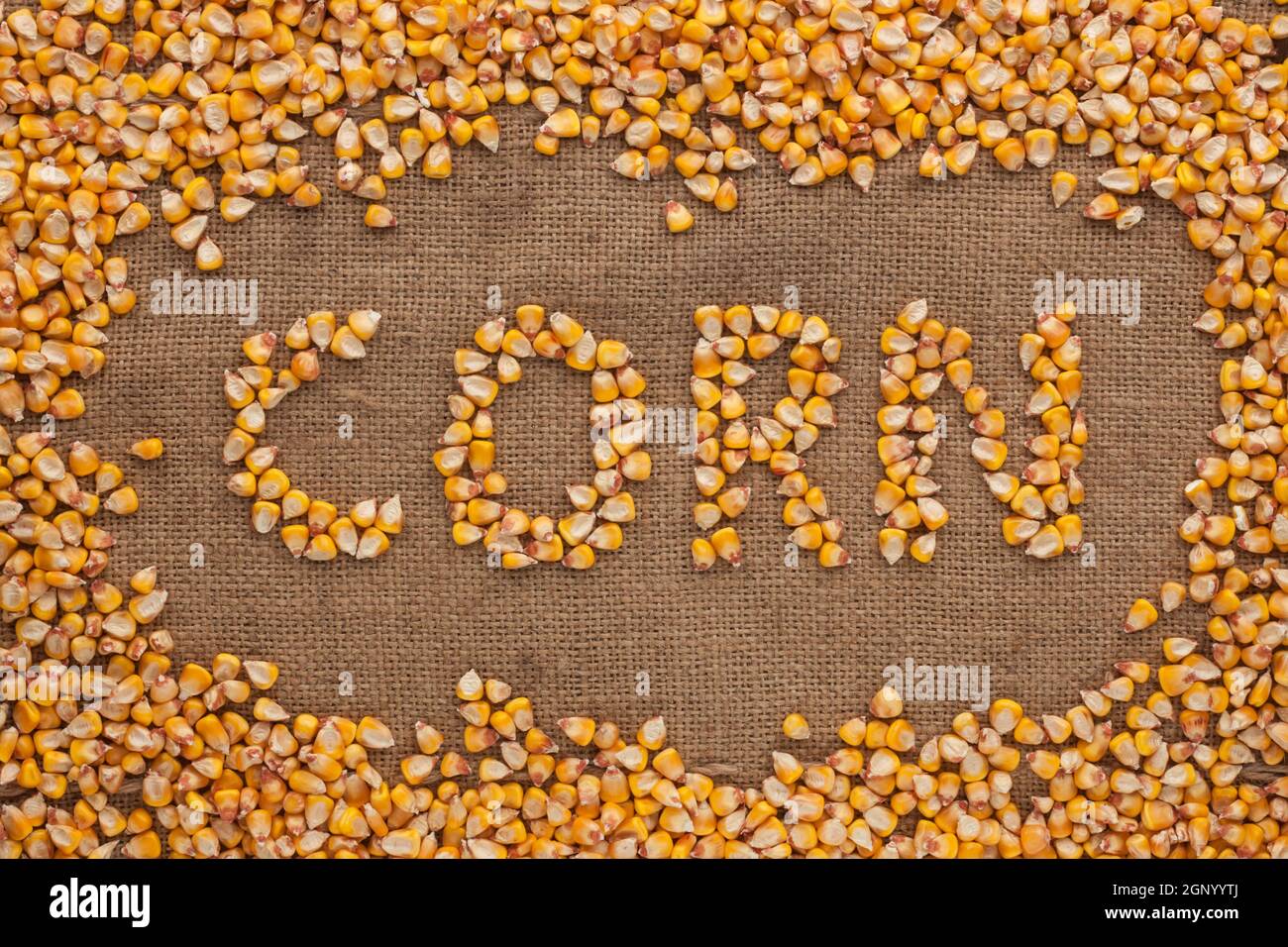 Word corn written on burlap , background Stock Photo - Alamy