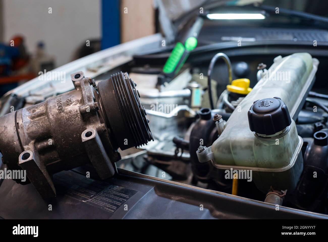 Automobile engine with disassembled parts in a Workshop Stock Photo - Alamy