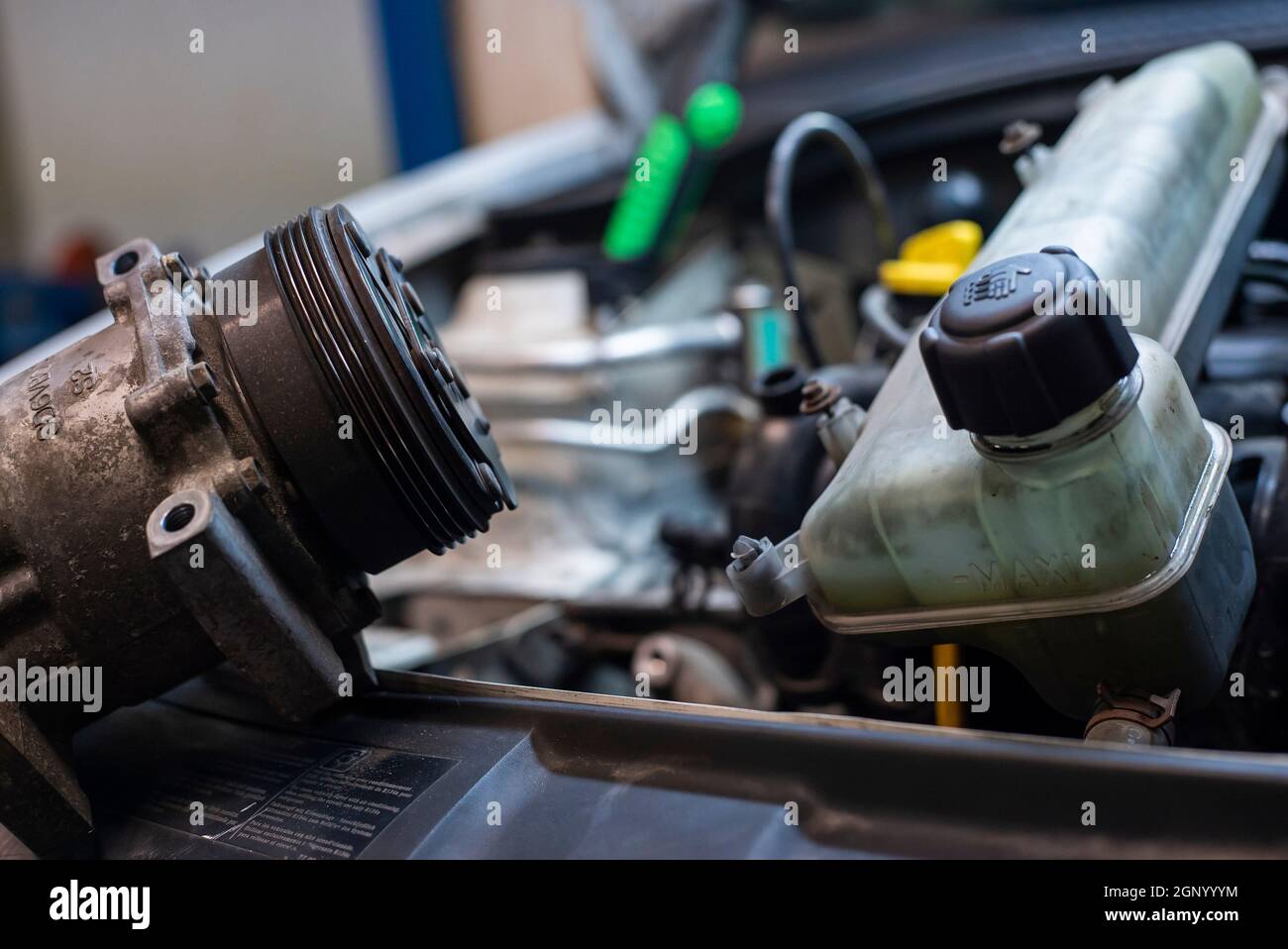 Automobile engine with disassembled parts in a Workshop Stock Photo - Alamy
