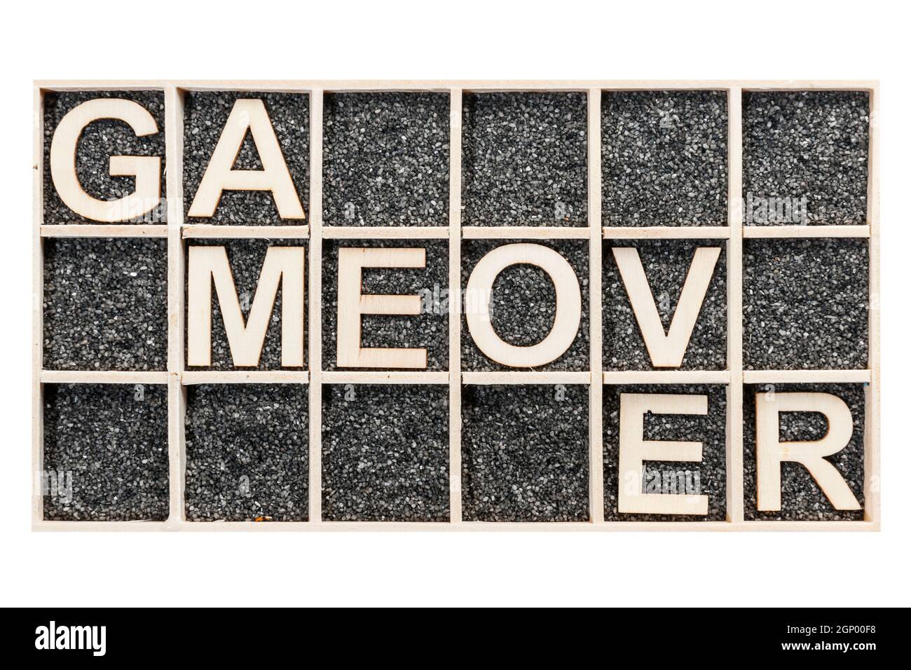 Plywood letters arranged in a collecting box with black decorative sand ...