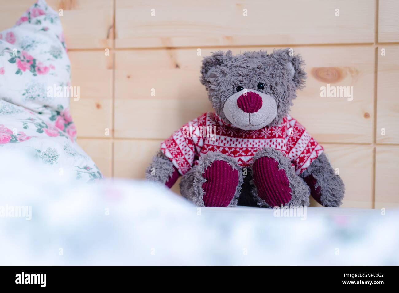Cute teddy bear toy is sitting in the bed, wakeup at morning Stock ...
