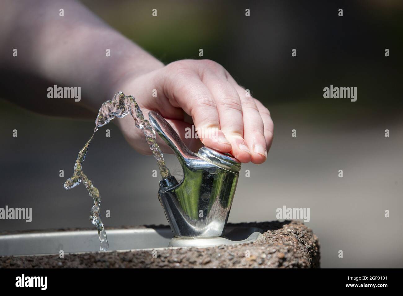 Water from an outdoor water fountain spurting up Stock Photo - Alamy